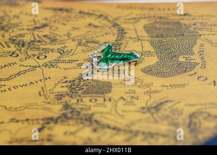 Elven Lorien brooch lies on Middle-Earth map Stock Photo - Alamy