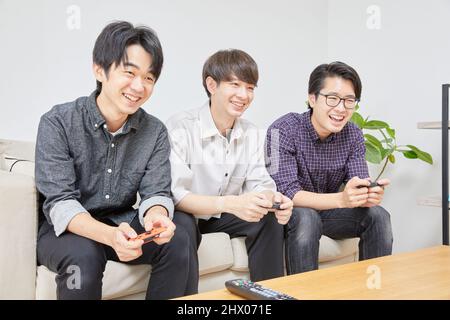 Japanese Men Playing Video Games Stock Photo - Alamy