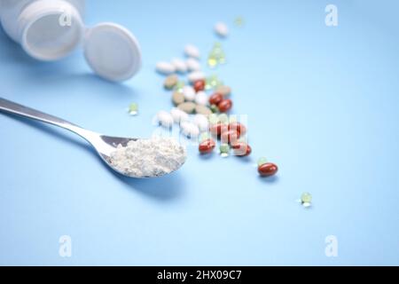 Nutritional supplements, vitamins and nutraceuticals on blue background ...