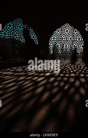 Islamic photo. Shadows of the decoration of the window on the ground in ...