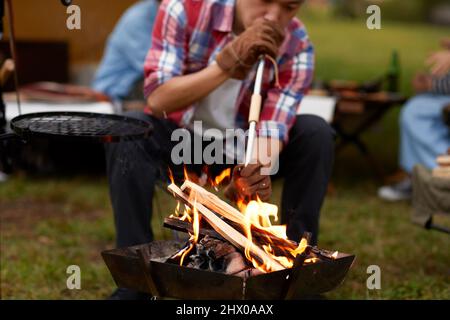 Japanese Men Making A Fire Stock Photo - Alamy