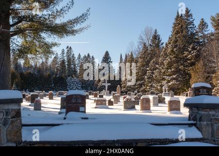 A Canadian cemetery in winter located in Saint-Adolph-d'Howard, Quebec ...