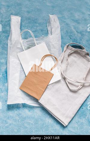single use plastic bag next to reusable canvas one, plastic pollution ...