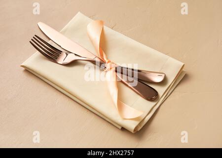 Simple table setting on beige background, closeup Stock Photo - Alamy