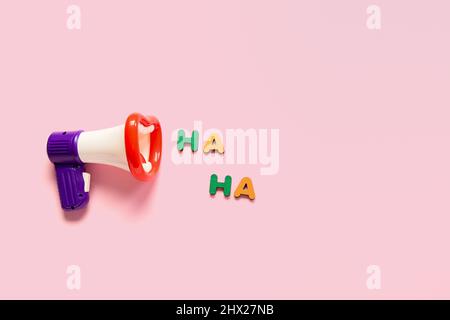 Composition with megaphone and text HA HA for April Fools Day ...