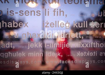 Maltese text at the bus stop Stock Photo - Alamy