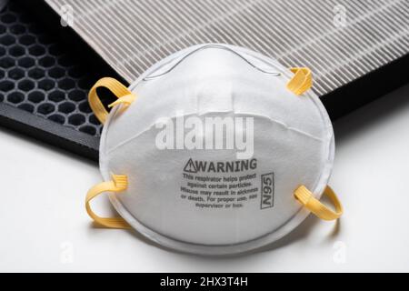 A half face dust mask and HEPA filter over white background Stock Photo ...