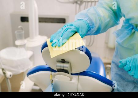 A nurse disinfects work surfaces in the dentist's office Stock Photo ...