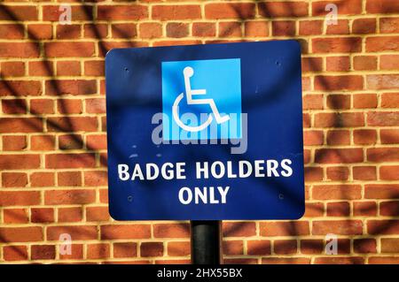 a disabled parking bay with wheelchair sign and parking distance ...