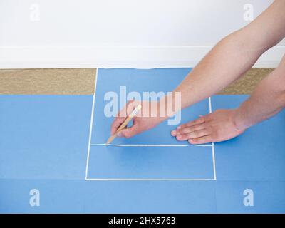 Laying vinyl tile floor, tiling a corner Stock Photo - Alamy