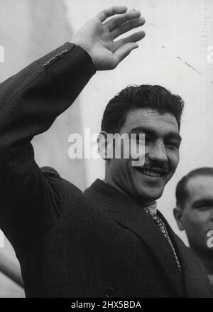 Former British European Heavyweight champion boxer Joe Bugner kisses ...