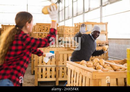 Two positive farmers are indulging during a break at work Stock Photo ...