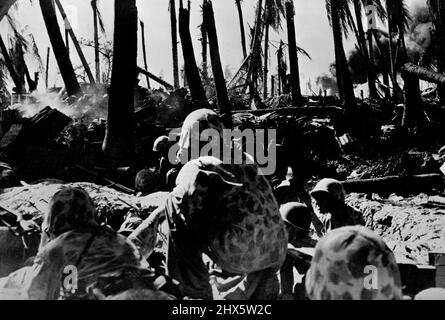 American destroyers hit a Japanese oil dump on Tinian Island, sending a ...