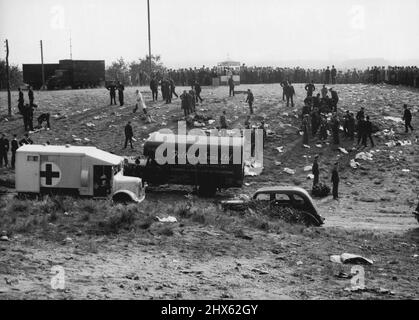 Rescue workers stand over one of two black boxes, the cockpit voice ...
