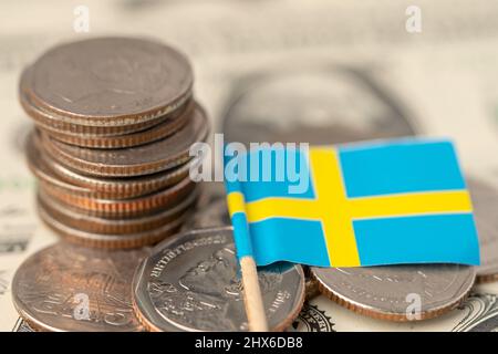 Stack of coins with Sweden flag on USA America dollar banknotes Stock ...
