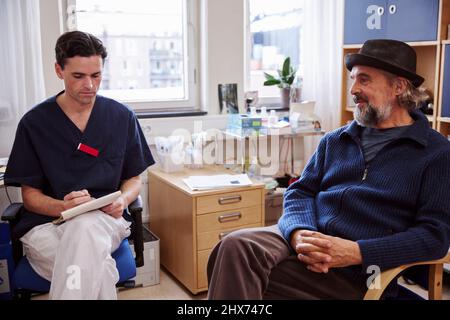 Senior man having doctor appointment Stock Photo - Alamy