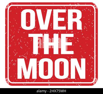 OVER THE MOON text written on blue-black grungy stamp sign Stock Photo ...