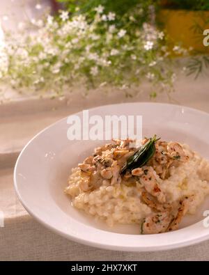 Rice risotto with chicken meat, potato, green pea, carrot and sliced ...