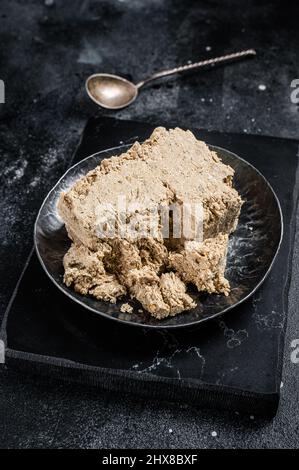 Homemade sunflower halva with honey. Black background. Top view Stock Photo - Alamy