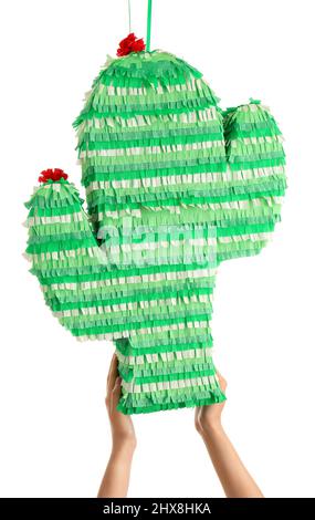 Woman holding Mexican pinata in shape of cube on color background Stock ...
