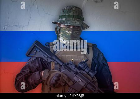 Angry soviet soldier armed with rifle with soviet union flag as ...