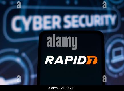 In this photo illustration, a Rapid7 company logo is seen displayed on ...