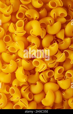 Raw Dry Organic Pipe Rigate Pasta in a Bowl on white background, side ...