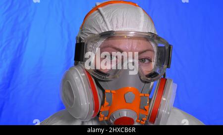 Scientist virologist in respirator. Slow motion. Man close up look ...