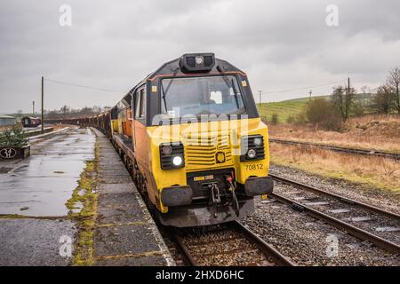 The 'log train' passes through Hellifield station whilst the Duchess of ...