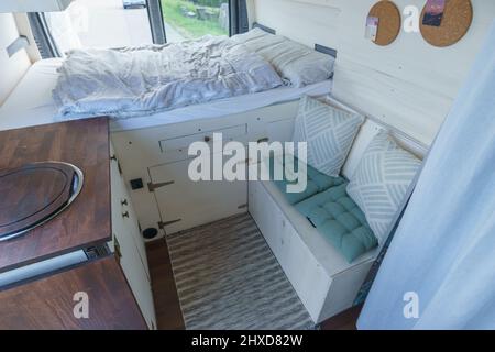 bright white and brown nterior of a self made camper van transporter ...