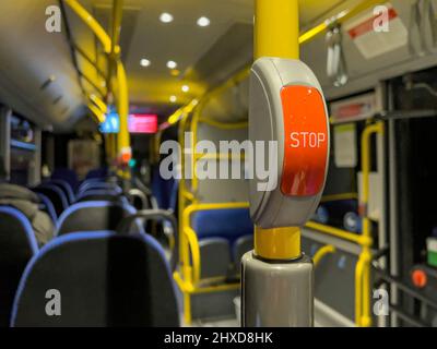 Red stop button in public transport. Bus stop button at the request of ...