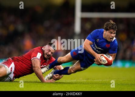 France's Antoine Dupont is tackled by Wales' Ben Thomas during the Six ...