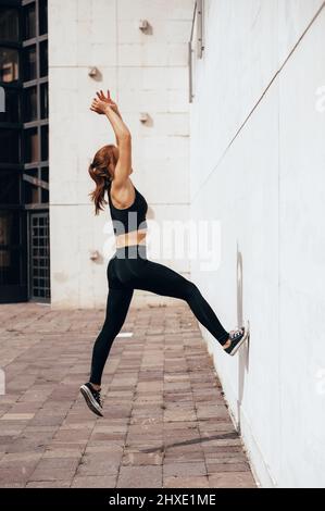 Young Girl Doing Backflip In Studio Stock Photo - Alamy