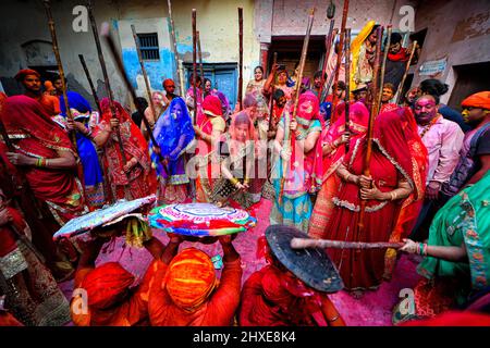 Hindu men are being ritually beaten with sticks (Lathi) during the ...