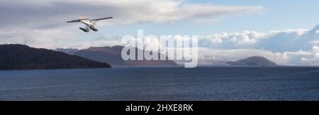 Seaplane Aircraft Flying over the Pacific Ocean Coast and Rocky ...
