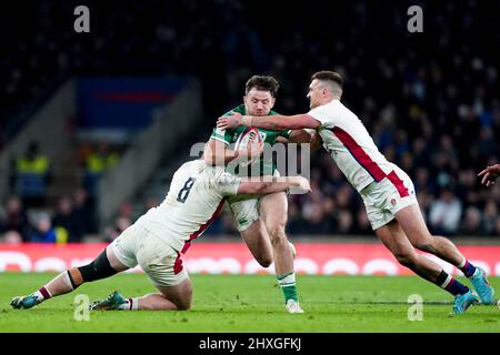 England's Henry Slade (centre) is tackled by Argentina's Rodrigo Isgro ...