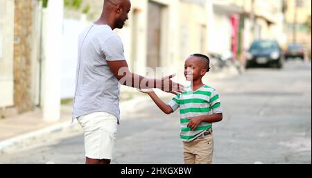 Father and son special handshake greetings. Dad and child bonding ...