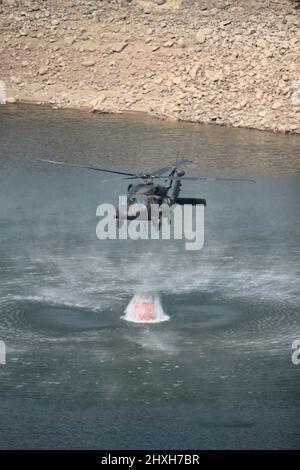 A UH-60 Blackhawk helicopter retrieves water from Kach’ang-josuji water ...