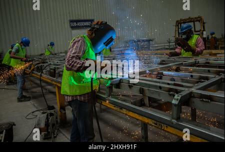 Hyderabad, India's Telangana state. 12th Mar, 2022. Workers of Megha ...
