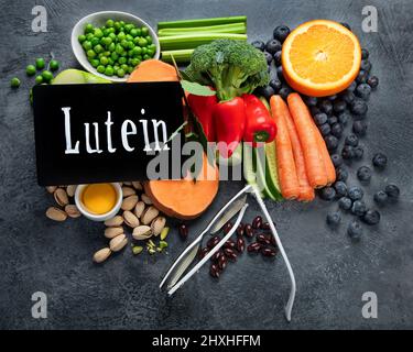 Foods high in lutein on dark background. Food for healthy eyes. High in ...