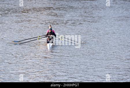 Two people in a fast row boat Stock Photo - Alamy