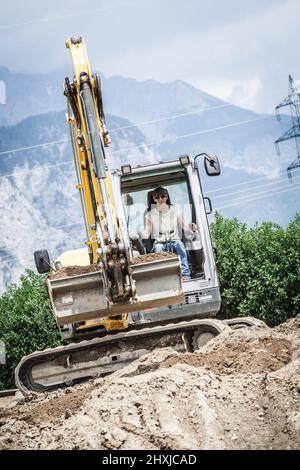 female excavator driver at work Stock Photo - Alamy