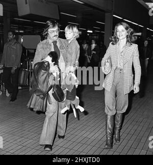Charlotte Rampling at Heathrow Airport with her son Barnaby and husband ...
