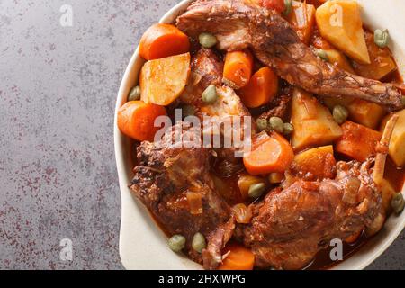 Rabbit Stew Maltese style or Stuffat tal-Fenek closeup in the pan on ...