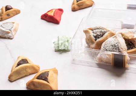 Purim celebration concept (jewish carnival holiday) over wooden green ...