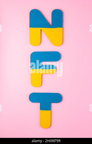 NFT inscription on pink background. Non-fungible token composed of ...