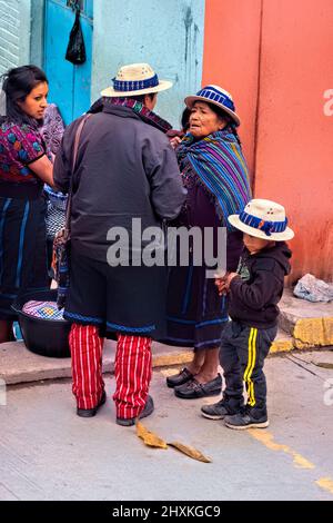 Guatemalan indigenous men in traditional clothing in the city of ...