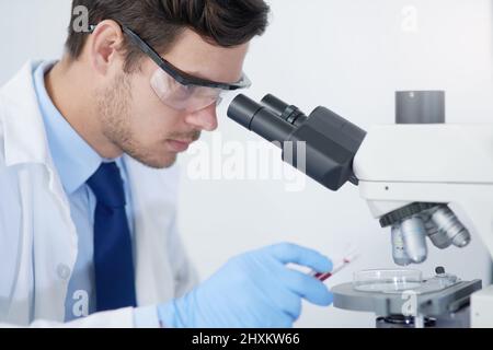 Identifying microorganisms that are causing infection. a young male ...