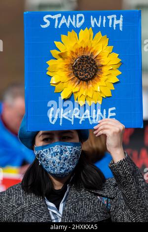 London, UK. 9 March 2022. A demonstrator shows solidarity with the ...