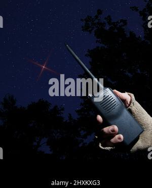 Red walkie-talkie radio and a white safety helmet on wooden background Stock Photo - Alamy